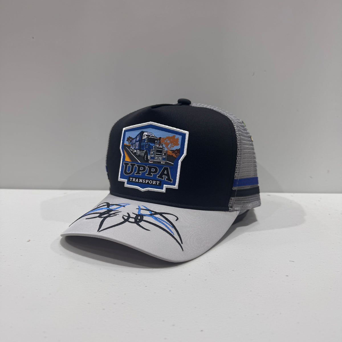 UPPA BLUE BADGE TRUCKER CAP – The Country Companies